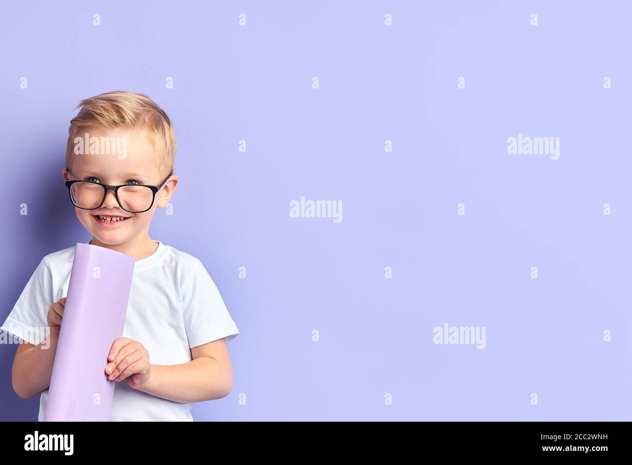 Smart kid wearing white t-shirt and glasses on eyes smiling look at ...