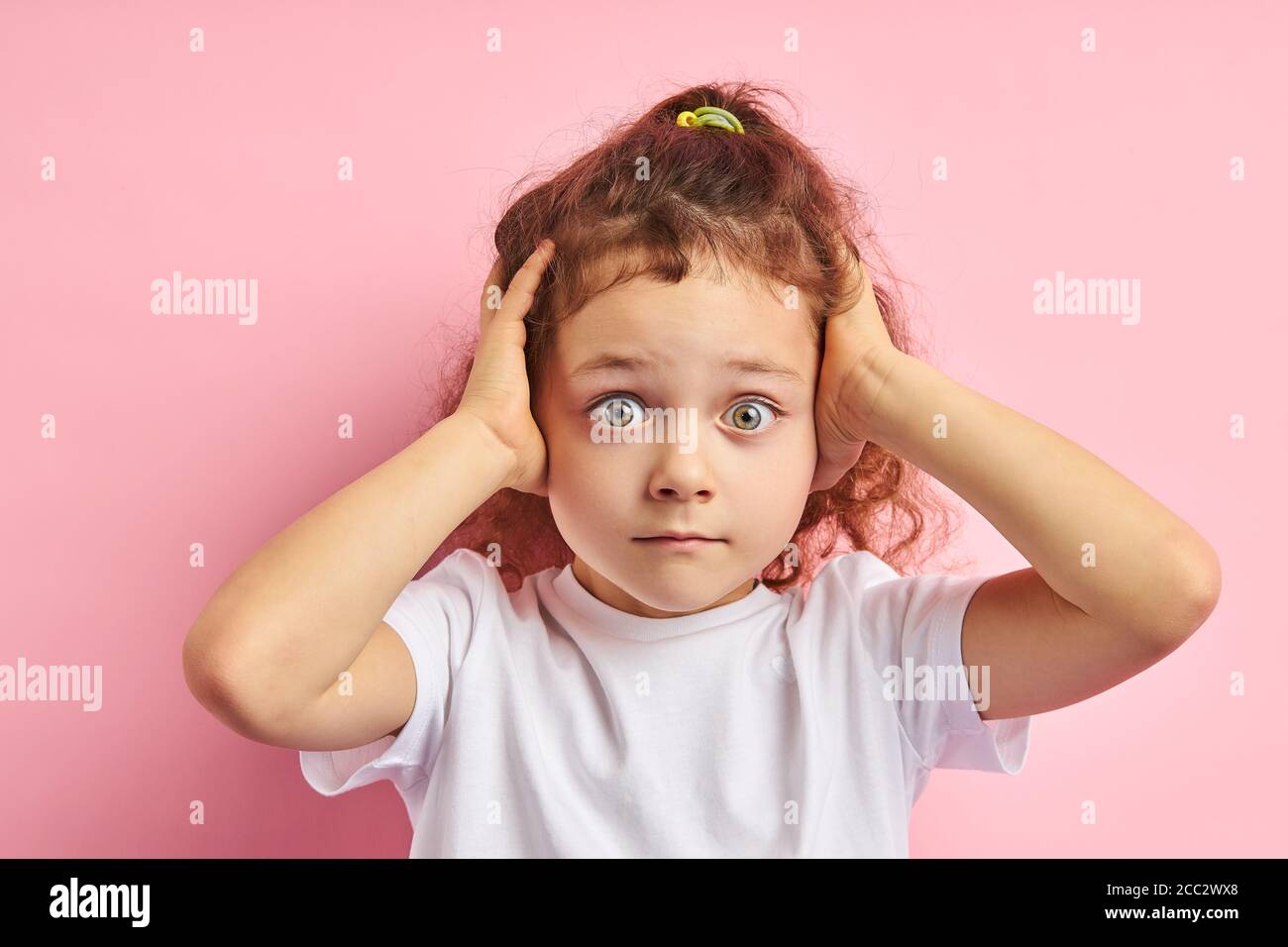 Girl clutching book hi-res stock photography and images - Alamy