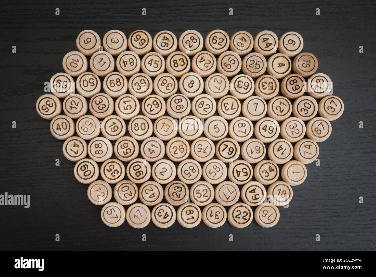 Wooden kegs on a black background. Top view Stock Photo - Alamy
