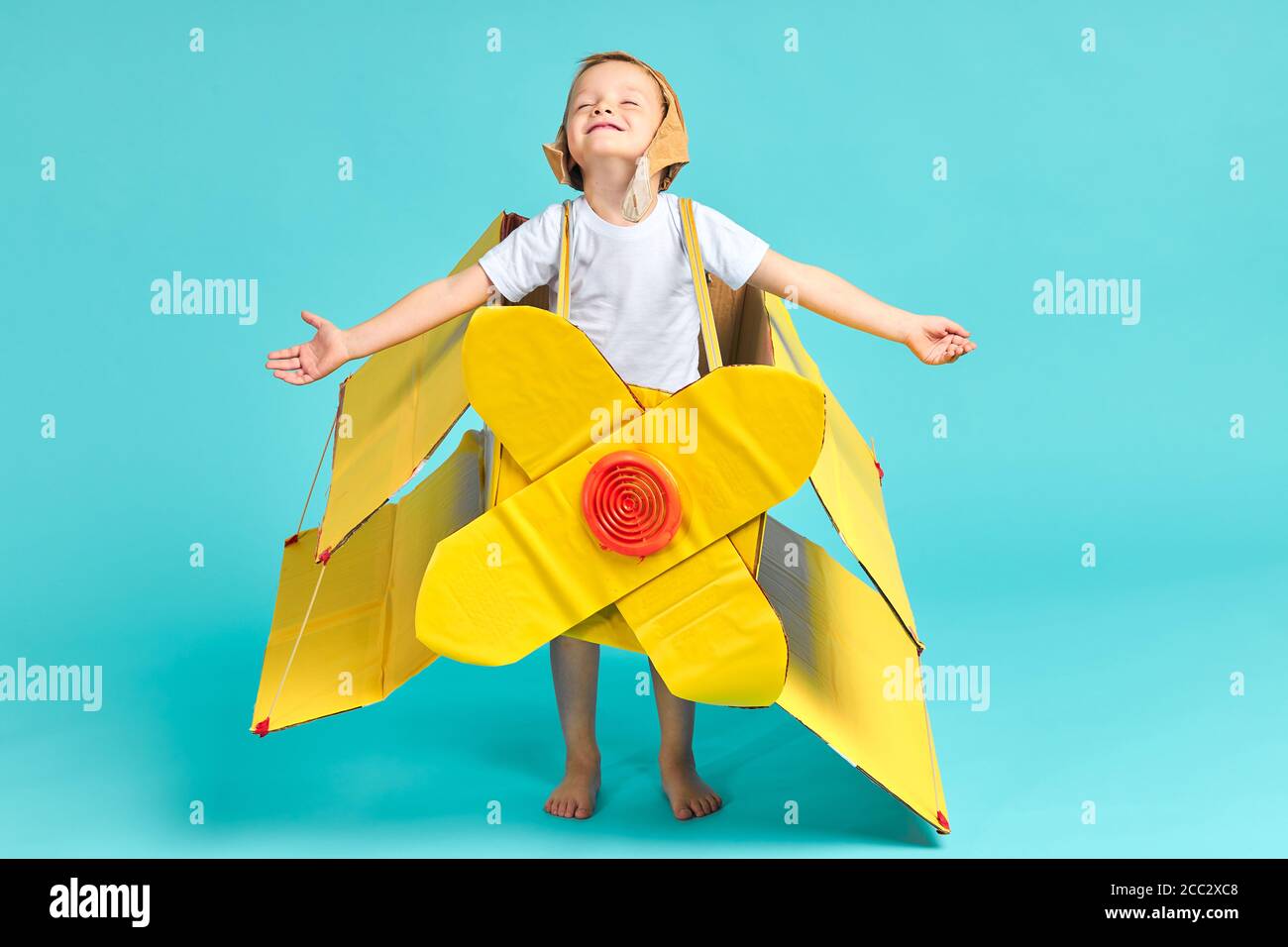 Dreams come true. Child boy represents how he flies at sky. Aviation ...