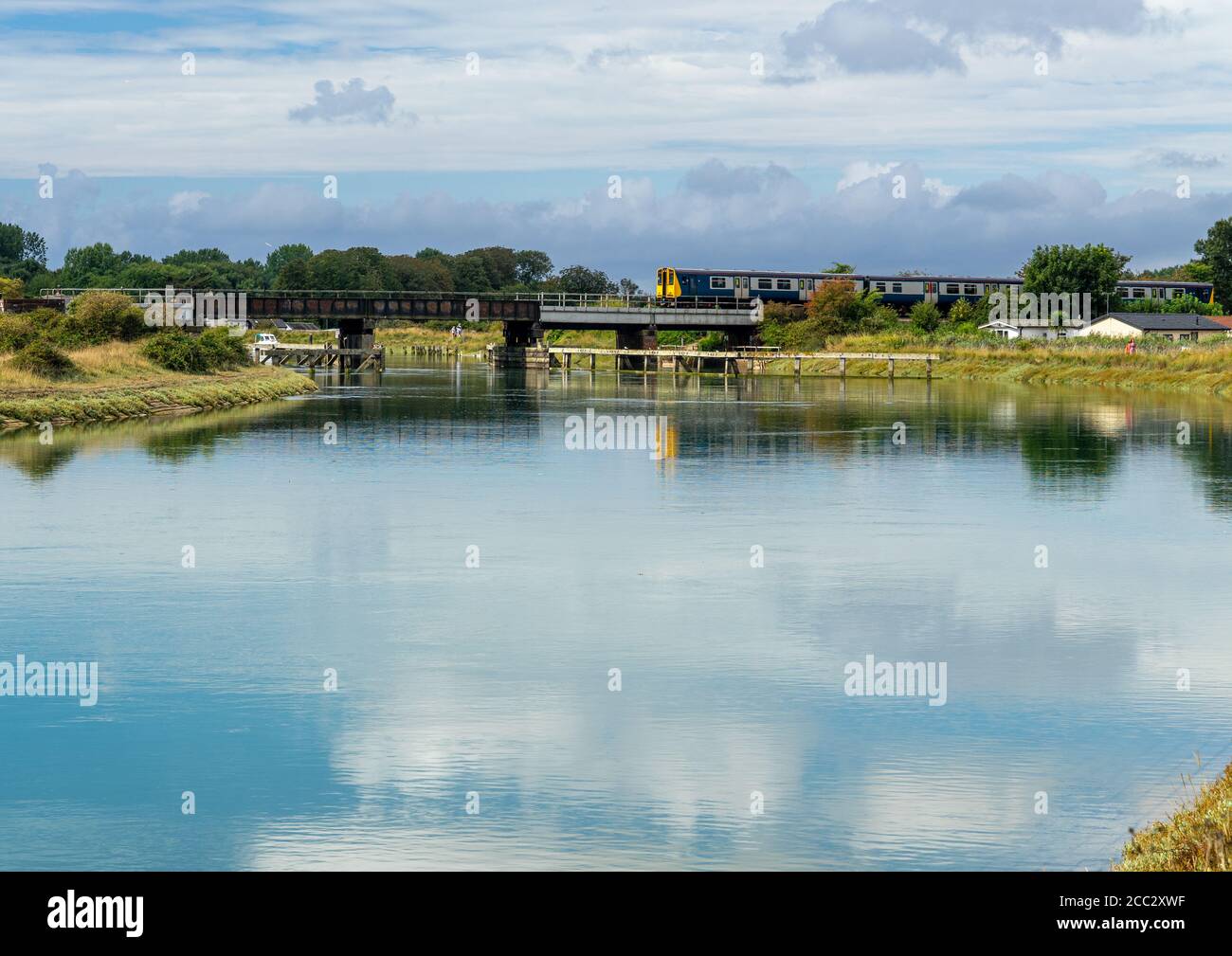 Train crossing the river Arun via the Ford viaduct bridge Stock Photo ...