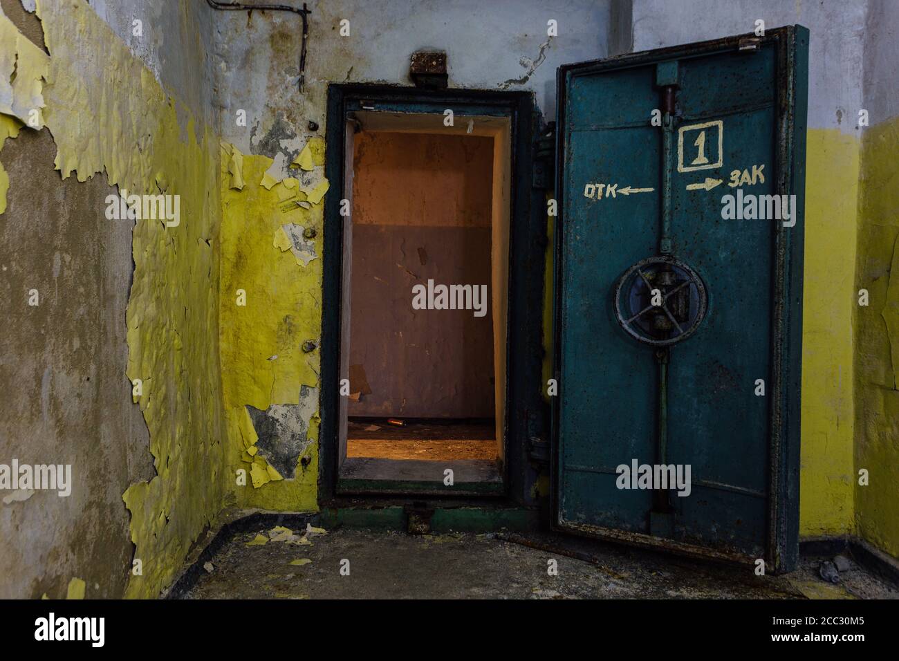 Opened heavy steel armored hermetic door in the Soviet bomb shelter ...