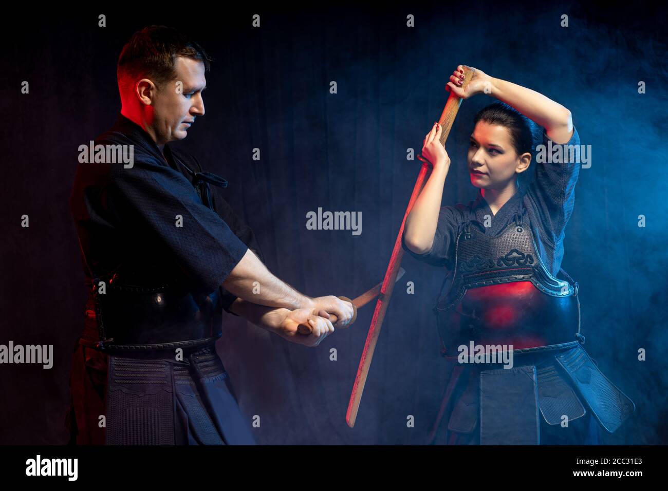 young caucasian female student learn how to fight with Kendo Sword ...