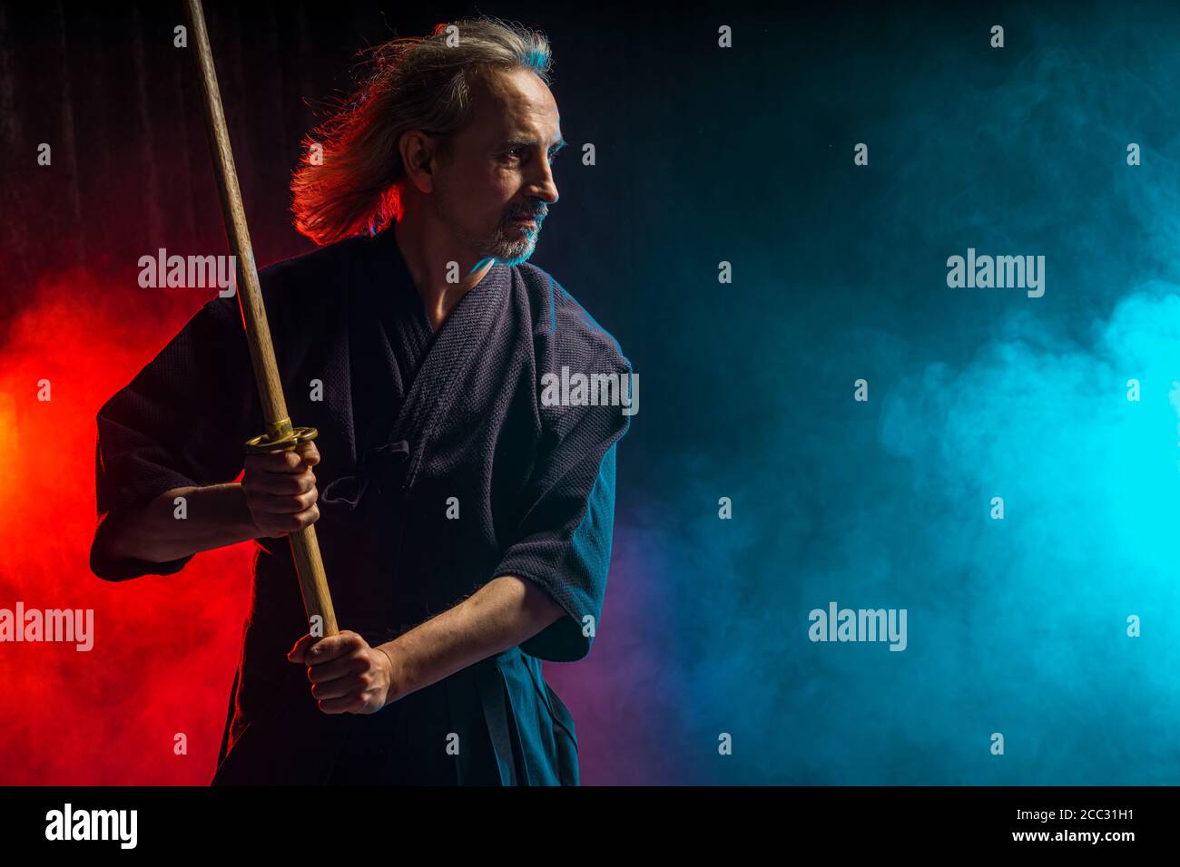 strong caucasian kendo fighter in traditional clothes. japanese martial ...