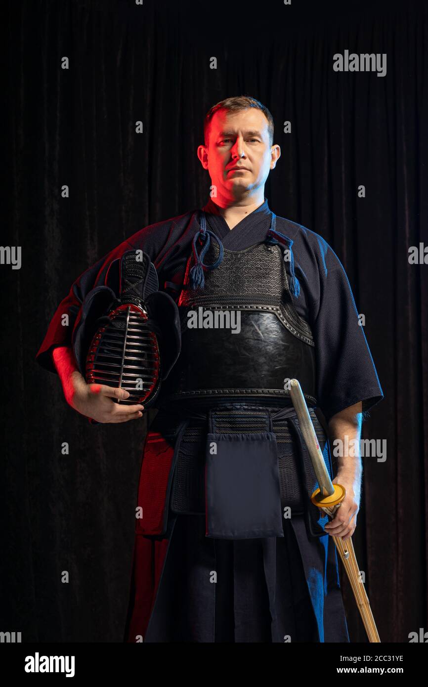 caucasian male kendo fighter in traditional Japanese style of clothing ...