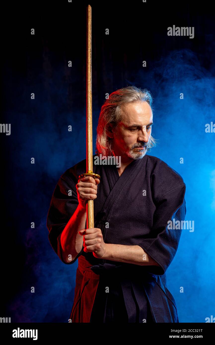 caucasian male kendo fighter in traditional Japanese style of clothing ...