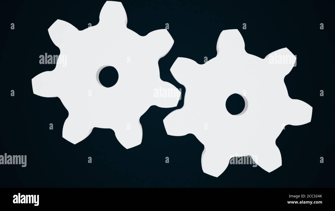 Computer generated the gears are turning slowly on simple background ...