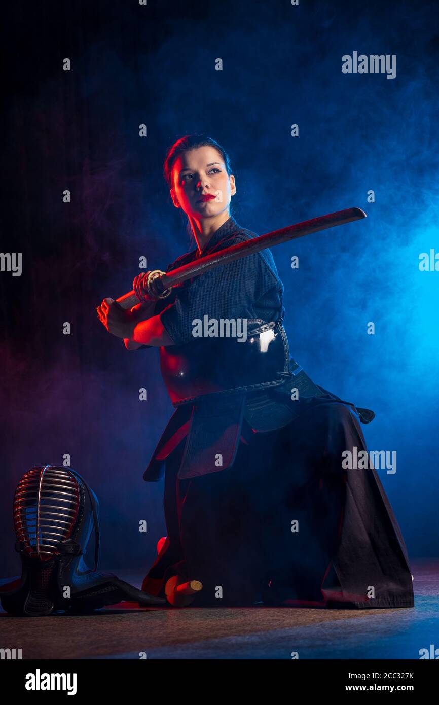 powerful caucasian female kendo warrior with shinai in hands, woman ...