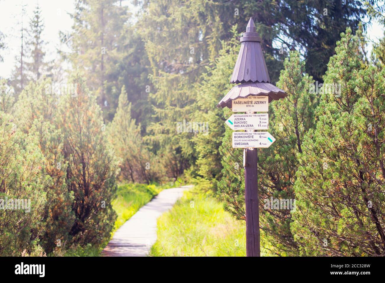 tourist signpost - wooden pole with pointers - Jizerky bog, Czech ...