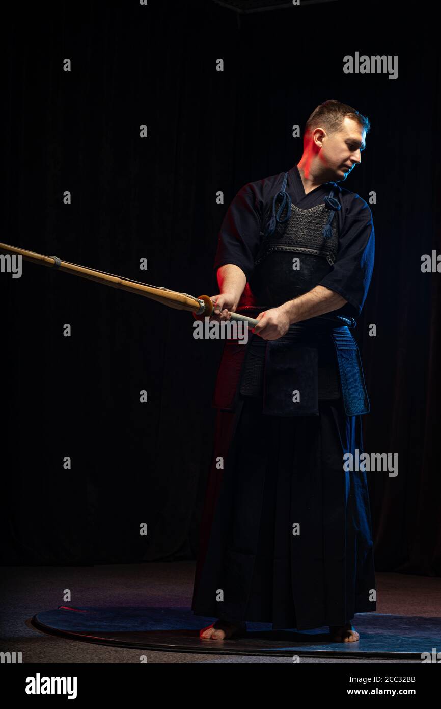 caucasian male kendo fighter in traditional Japanese style of clothing ...