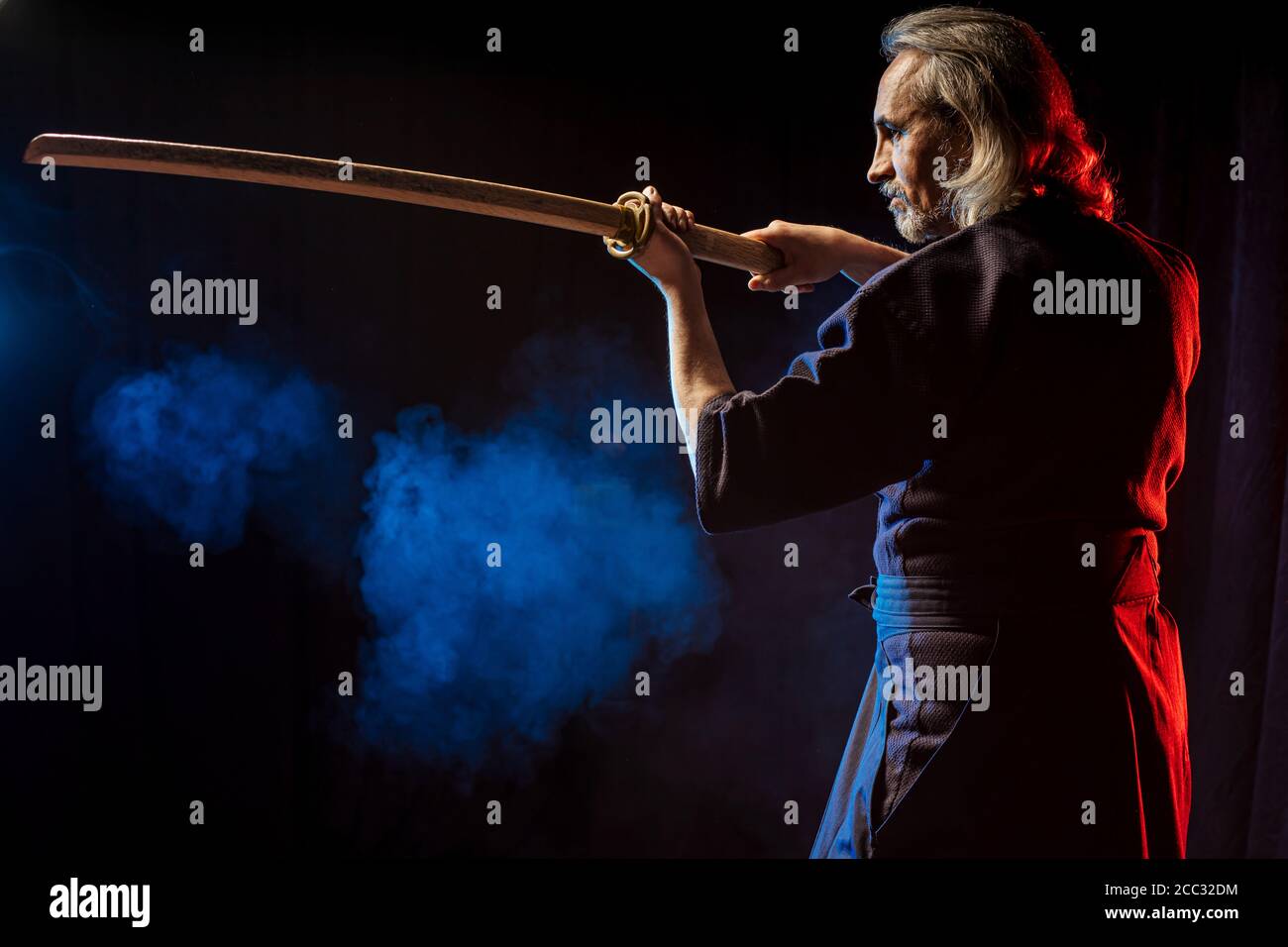strong caucasian kendo fighter in traditional clothes. japanese martial ...