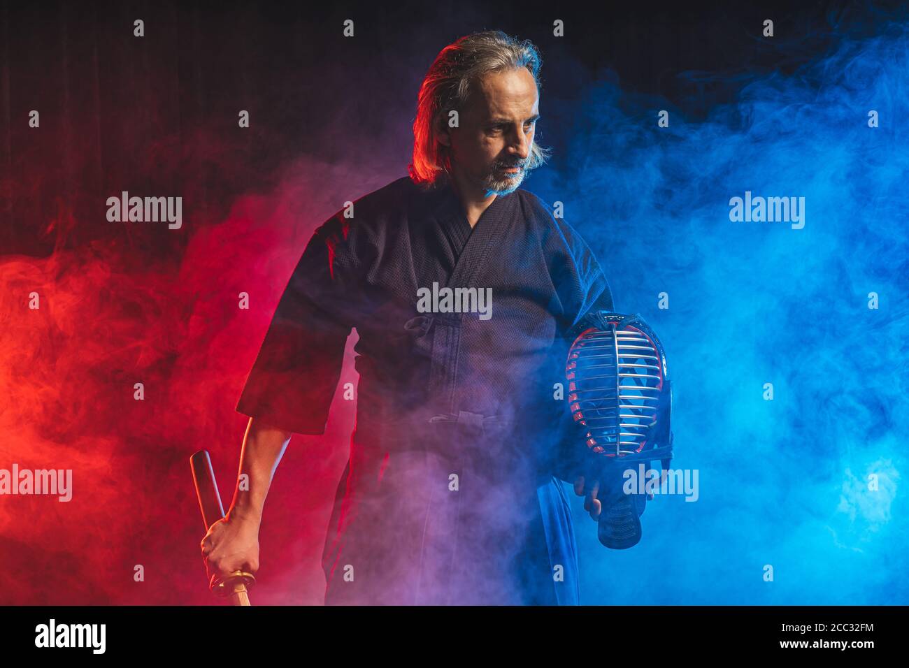 strong caucasian kendo fighter in traditional clothes. japanese martial ...