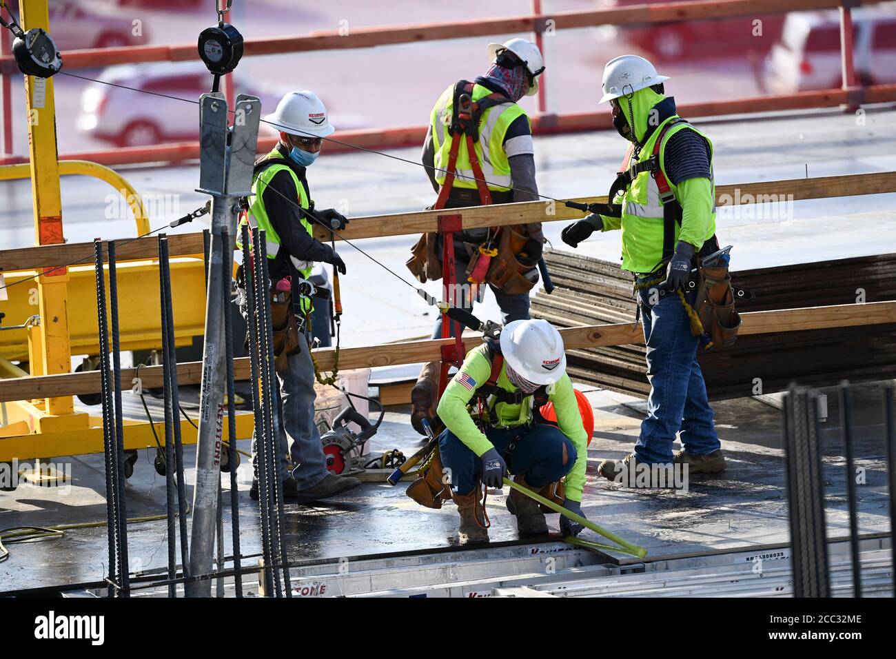 Concrete crew works on a parking garage that's part of a 53-story high ...