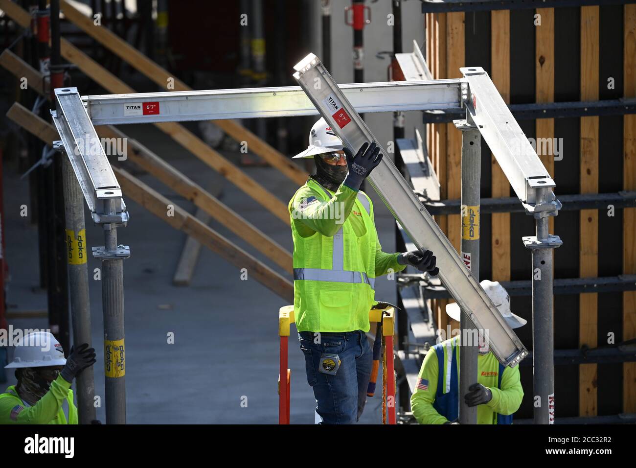 Concrete crew works on a parking garage that's part of a 53-story high ...