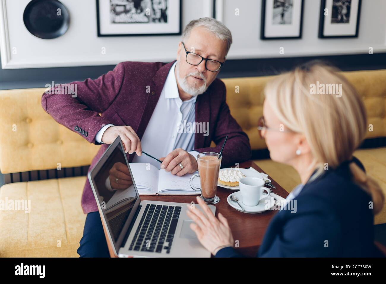new colleague consulting with experienced chef. close up photo. man ...