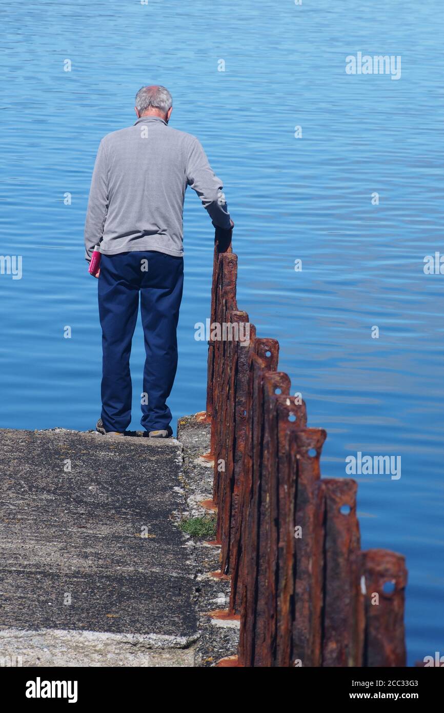 Man standing at the end of pier hi-res stock photography and images - Alamy
