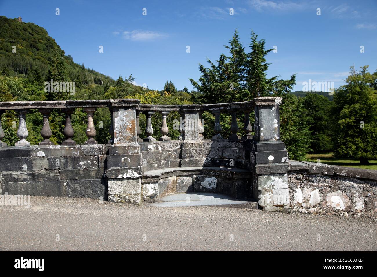 Ancient stone bridge parapet and arched stone seating area Stock Photo ...