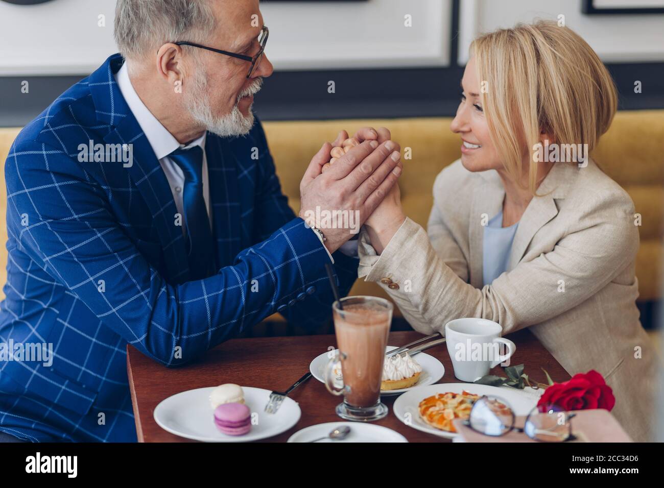 mature smart couple looking at each other with care and sincere ...