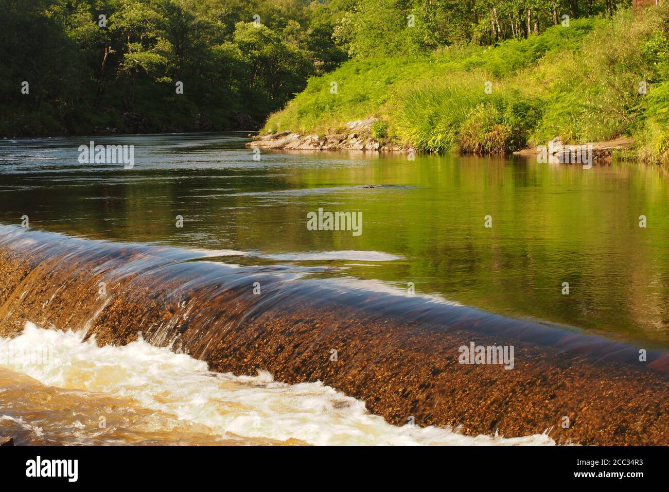 A view of the weir half way down Glen Orchy on the river Orchy ...