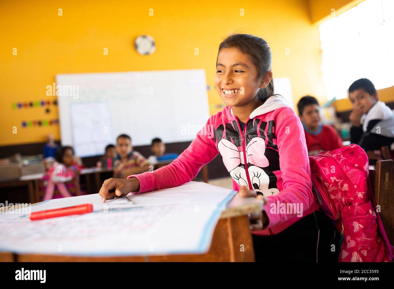 A girl learns in a primary school classroom in Sullana Province, Peru ...