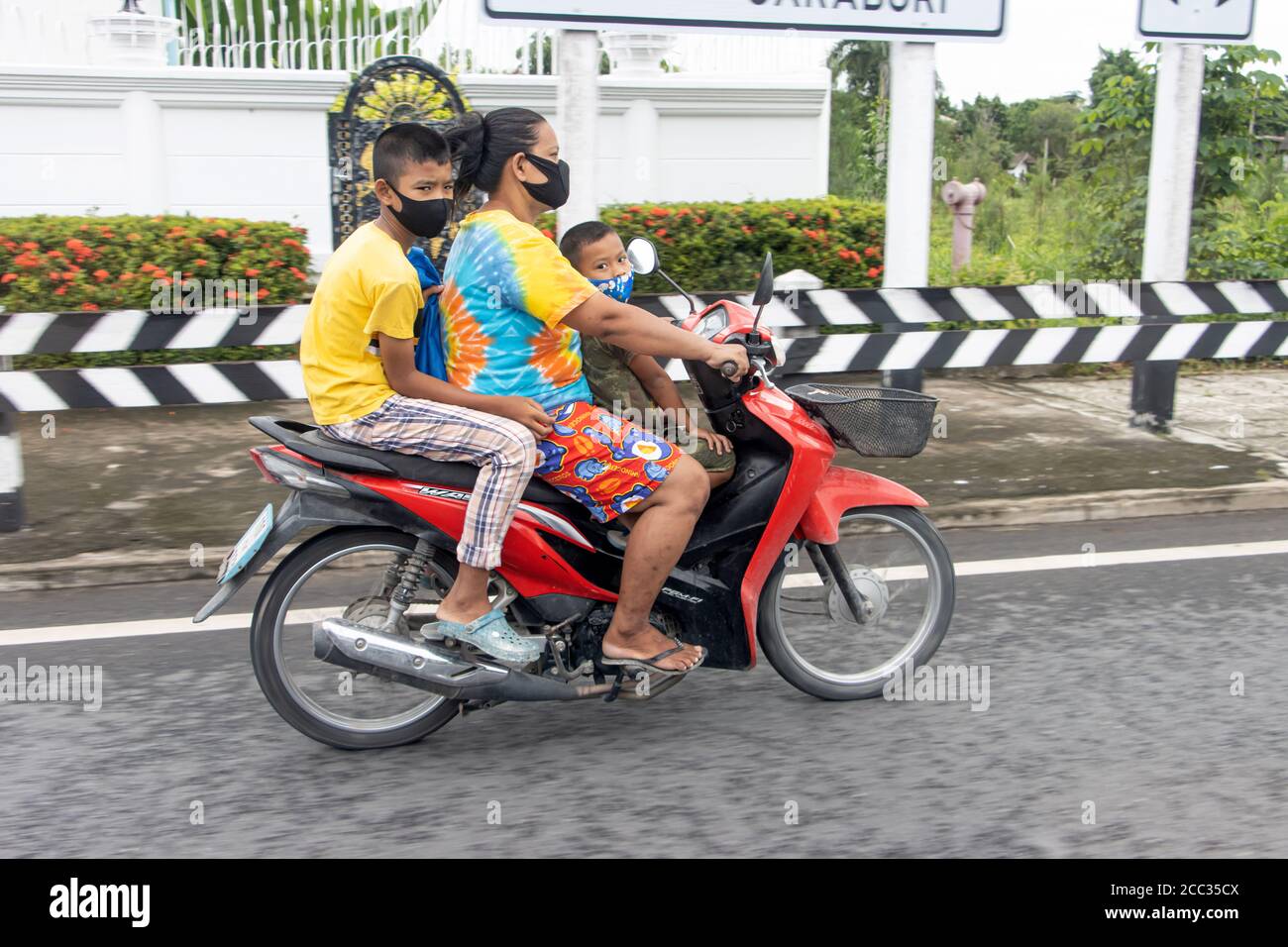 NAKHON NAYOK, THAILAND, JUL 04 2020, A Thai family rides together on a ...