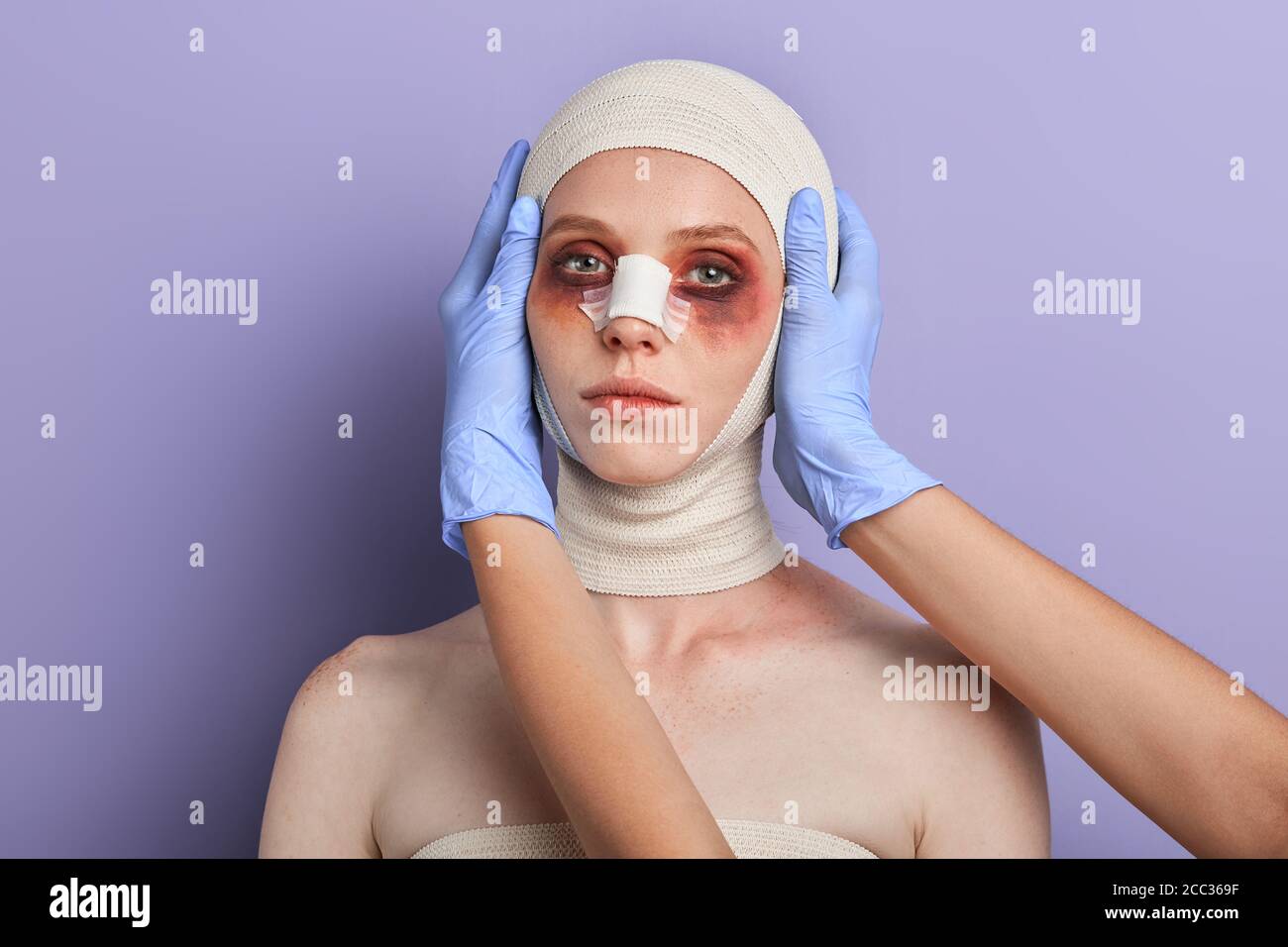 doctor preparing an injured woman for operation, close up portrait ...