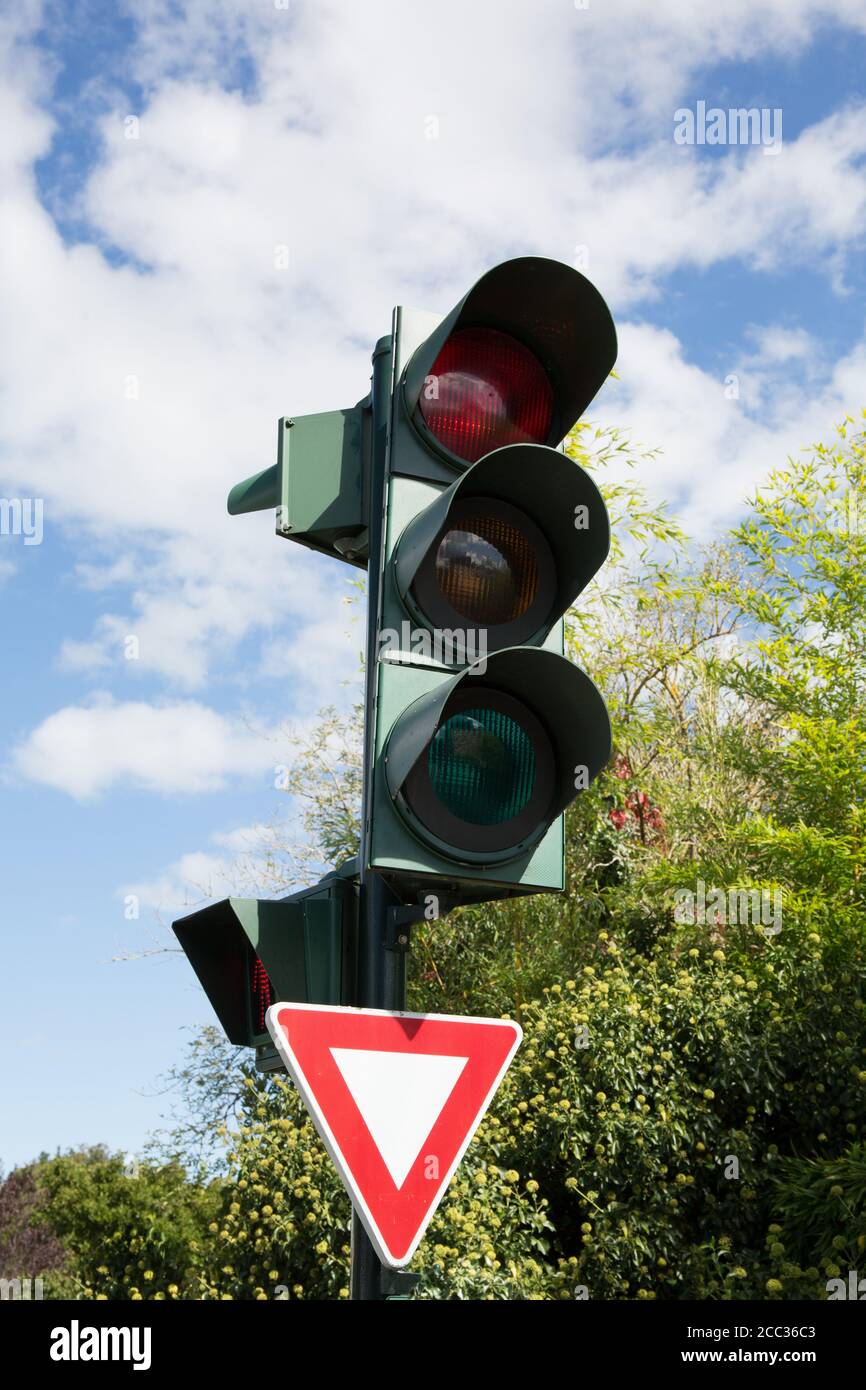 Traffic light with red color on blue sky background Stock Photo - Alamy