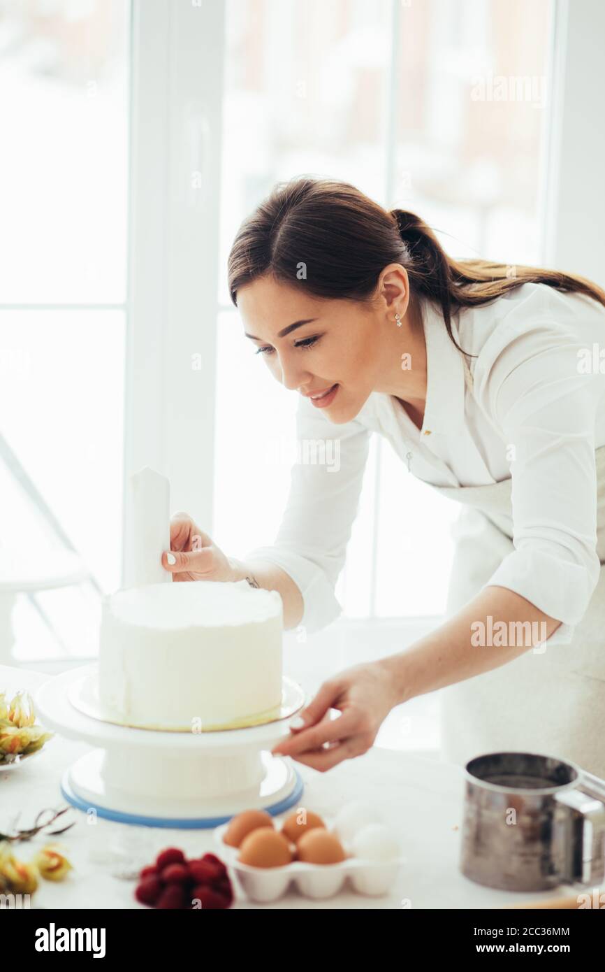 lovely girl making cake beautiful, close up side view photo Stock Photo ...