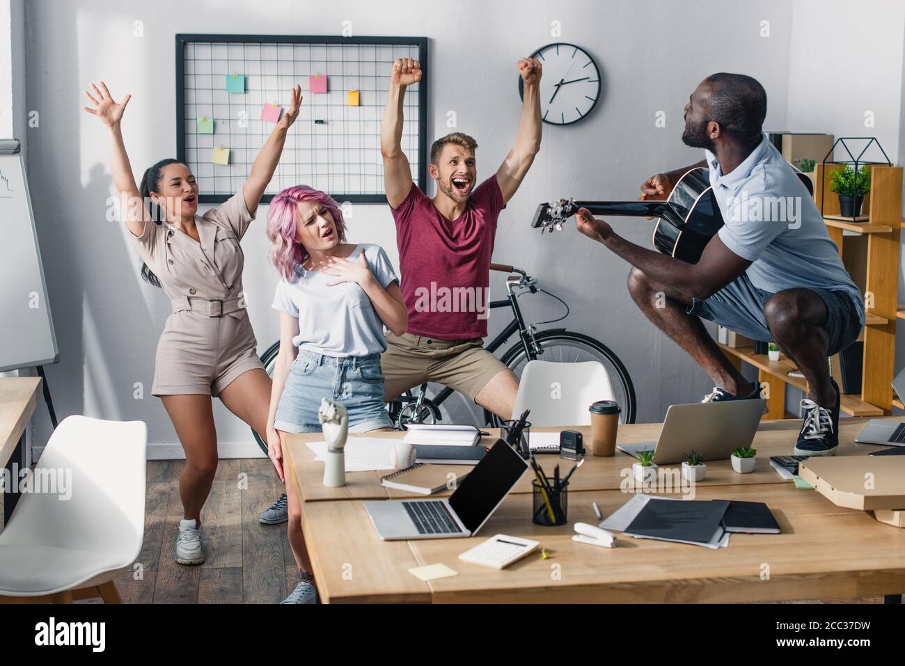 Selective focus of business people dancing near african american ...