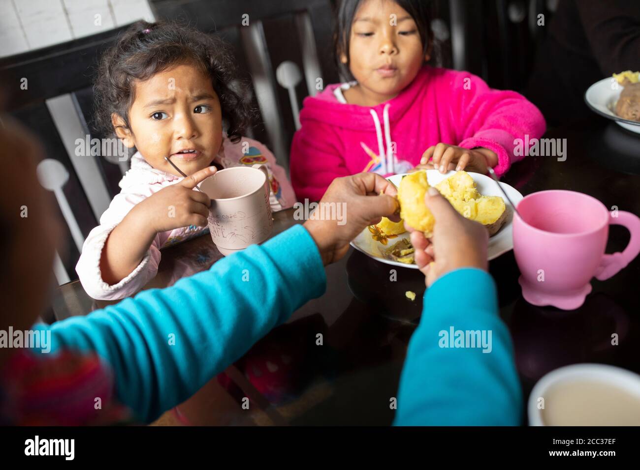 Children eating sweet potato hi-res stock photography and images - Alamy