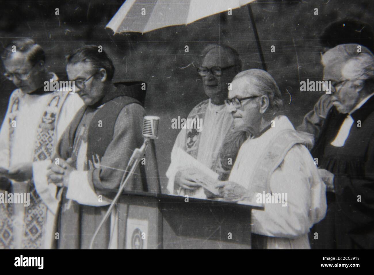 Fine 1970s vintage black and white photography of a priest speaking at ...