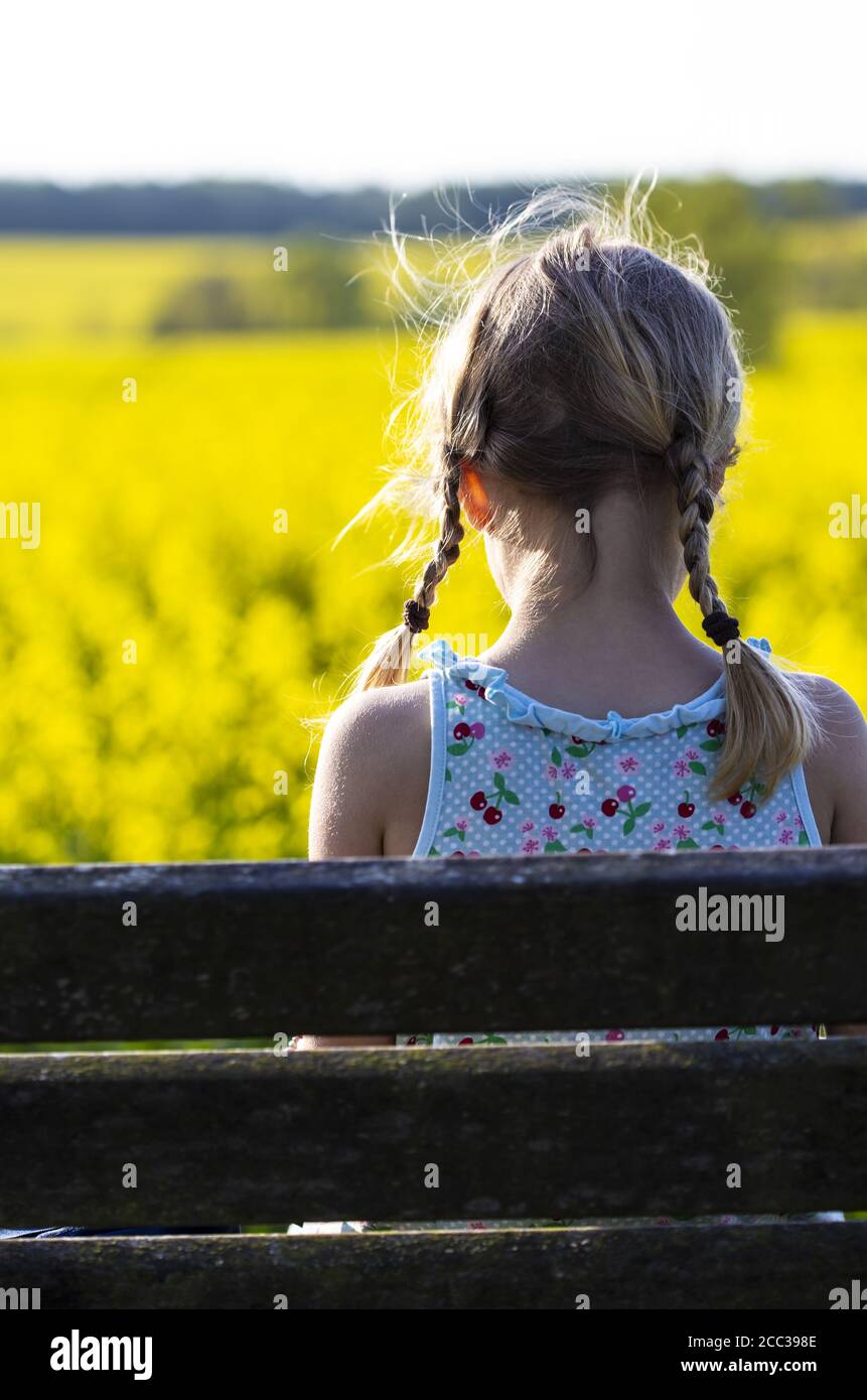 Girl on park bench hi-res stock photography and images - Alamy