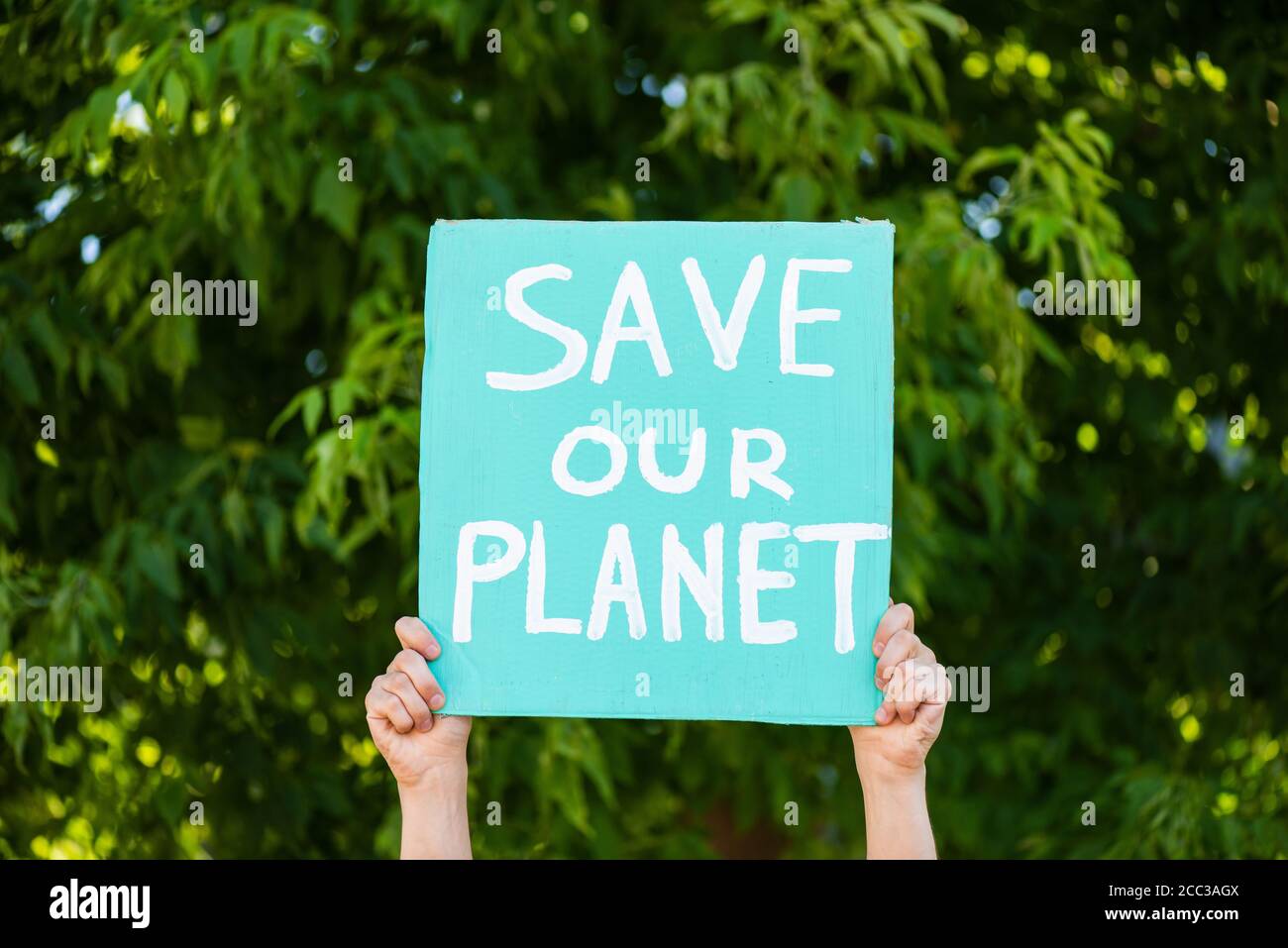 Cropped view of man holding placard with save our planet words with ...