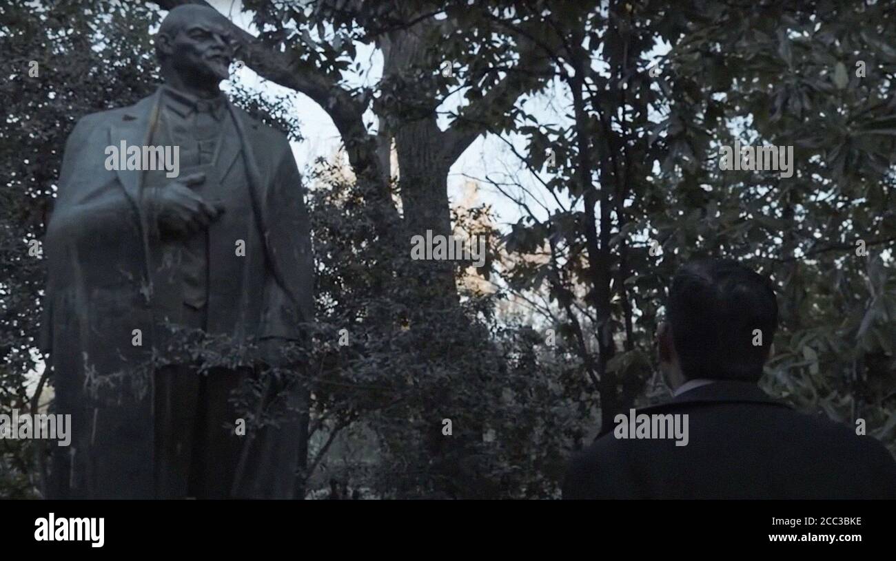 TRUMP CARD, Dinesh D'Souza gazing at a statue of Vladimir Lenin, 2020 ...