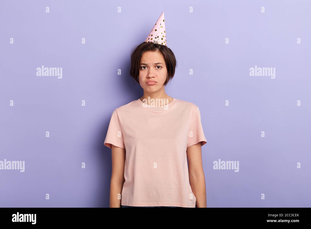 Disappointed unhappy beautiful girl feels lonely on her birthday, waits ...