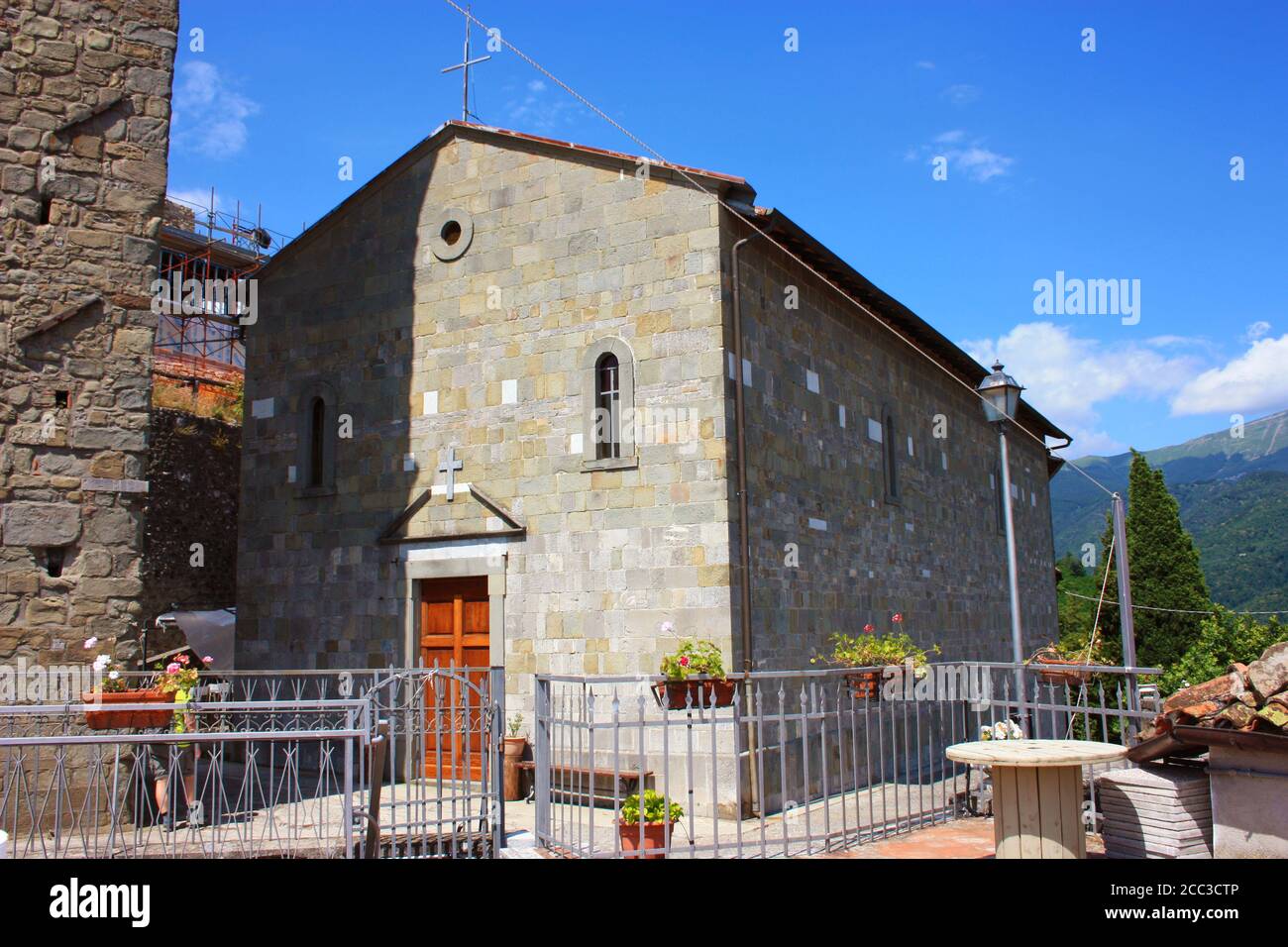 rustic christian church with typical stone walls in a rural village in ...
