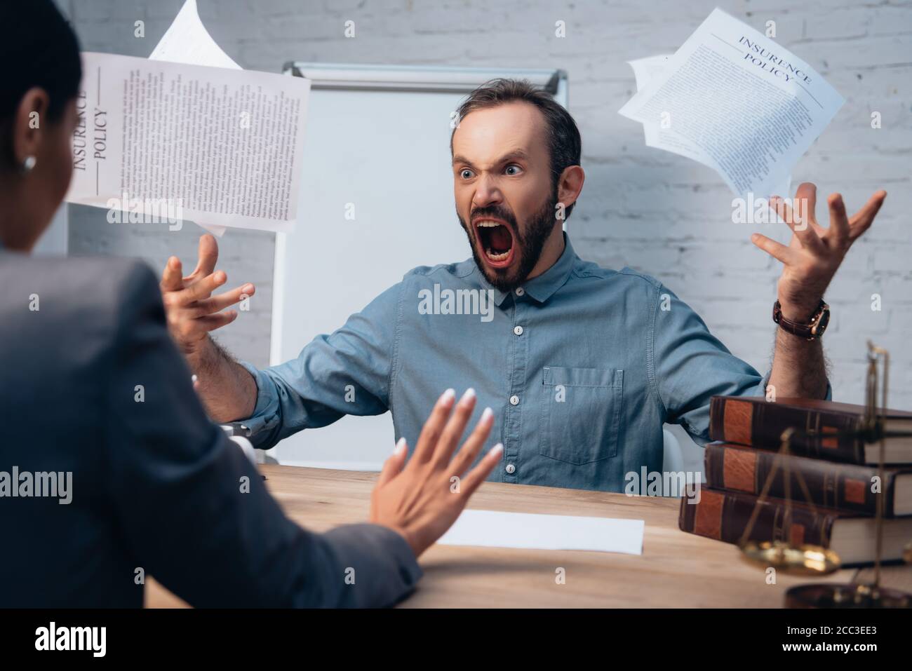 Man throwing books hi-res stock photography and images - Alamy
