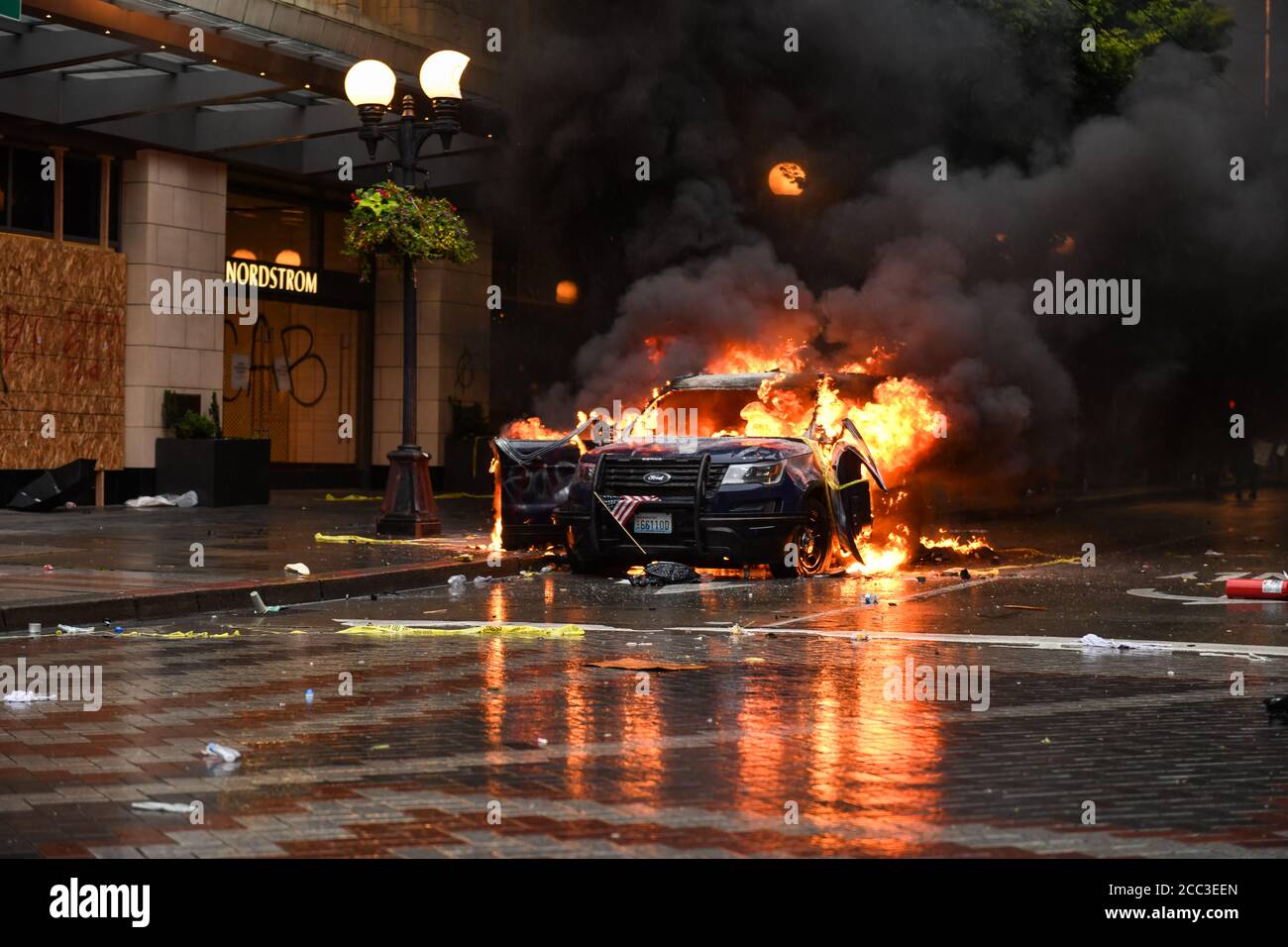 Seattle, USA May 30th, 2020: Late in the day a burning police car set ...