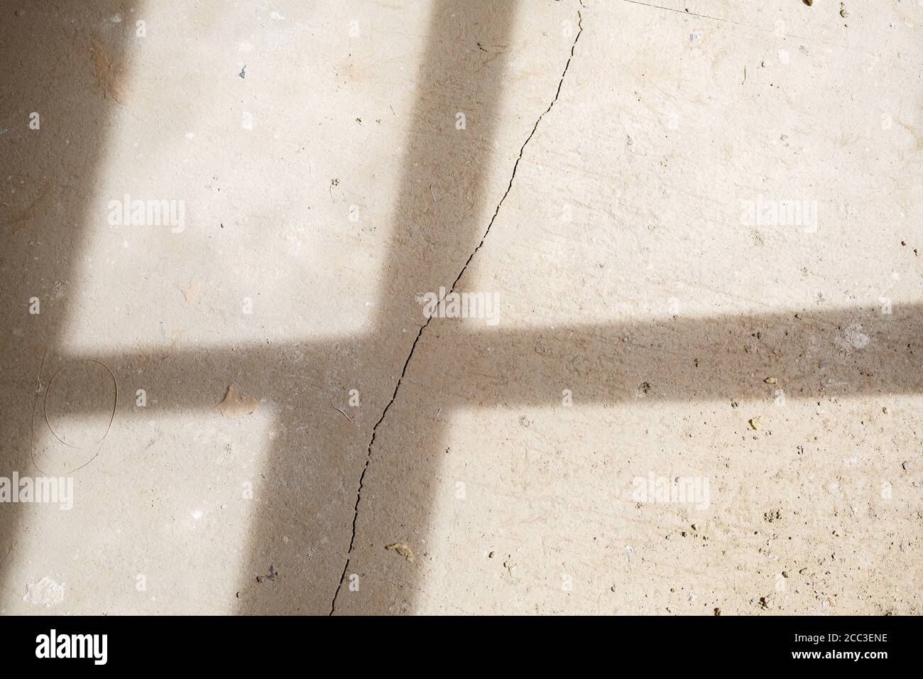 Cracks in the concrete cement screed on the floor after repair. The ...