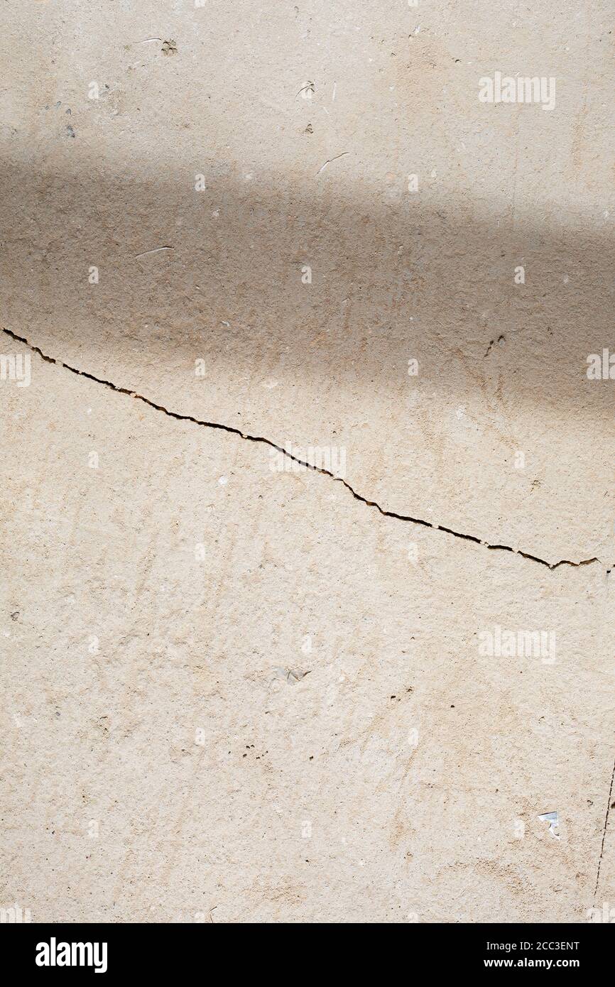 Cracks in the concrete cement screed on the floor after repair. The ...