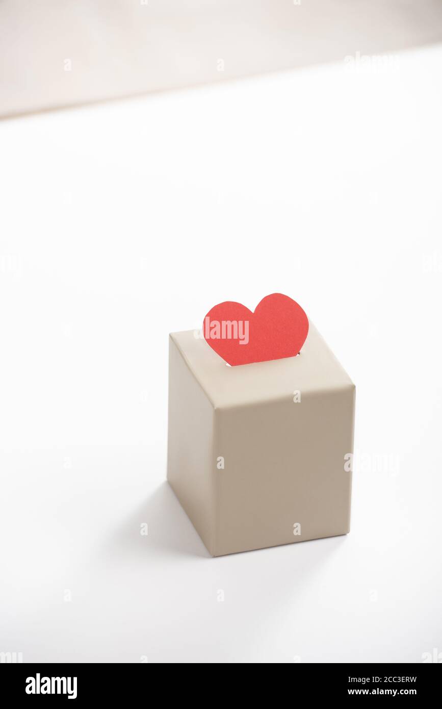 red heart in box on white background, donation concept Stock Photo - Alamy