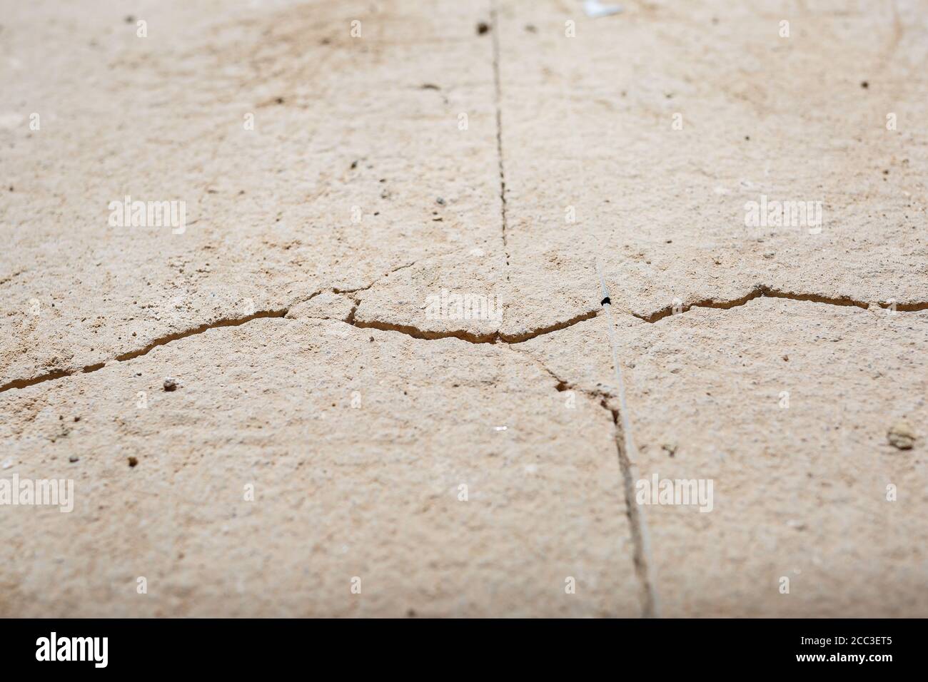 Cracks in the concrete cement screed on the floor after repair. The ...