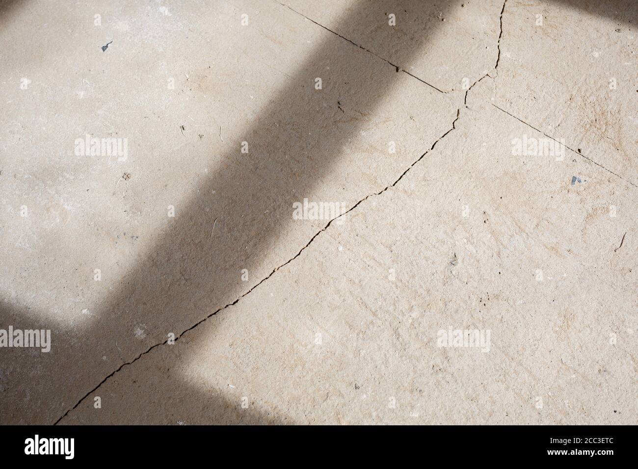 Cracks in the concrete cement screed on the floor after repair. The ...