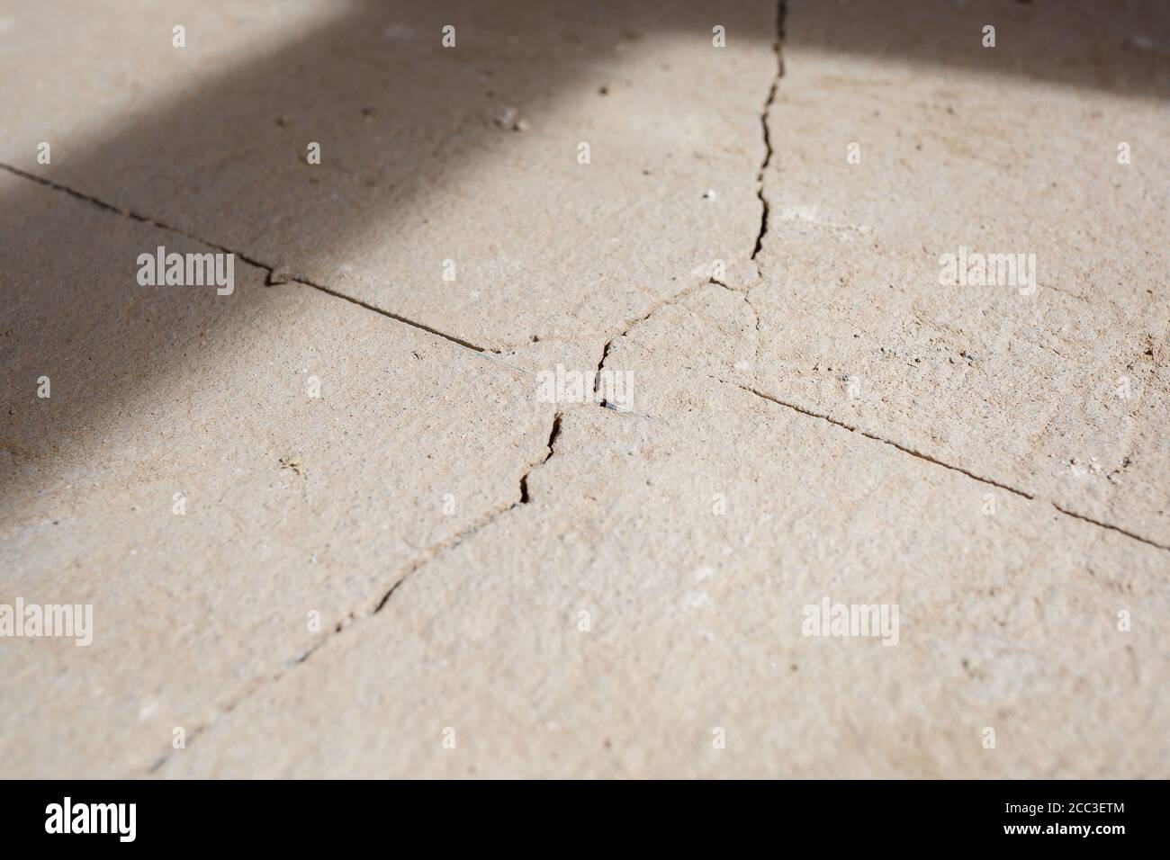 Cracks in the concrete cement screed on the floor after repair. The ...