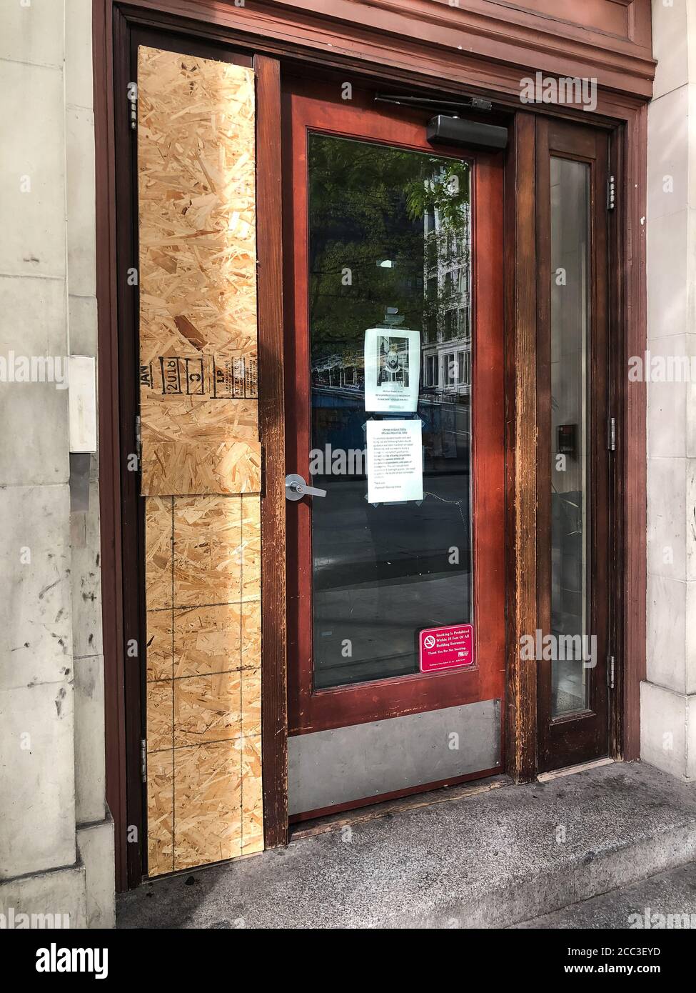 Seattle, USA - Apr 29, 2020: Late in the day a busted out glass window ...