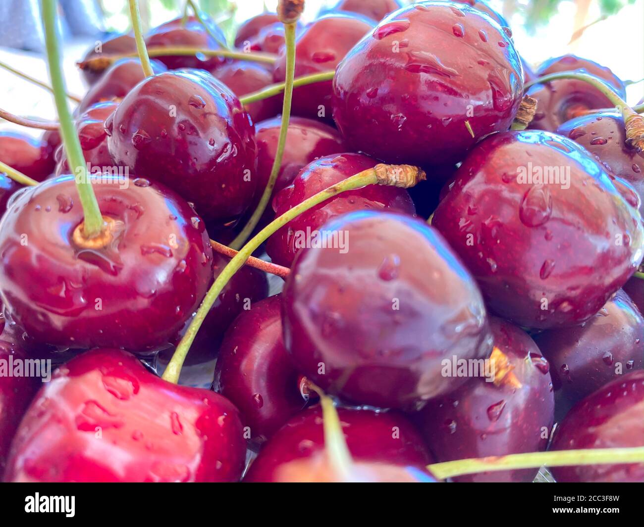 Red cherry background. Red ripe delicious cherries harvest Stock Photo ...