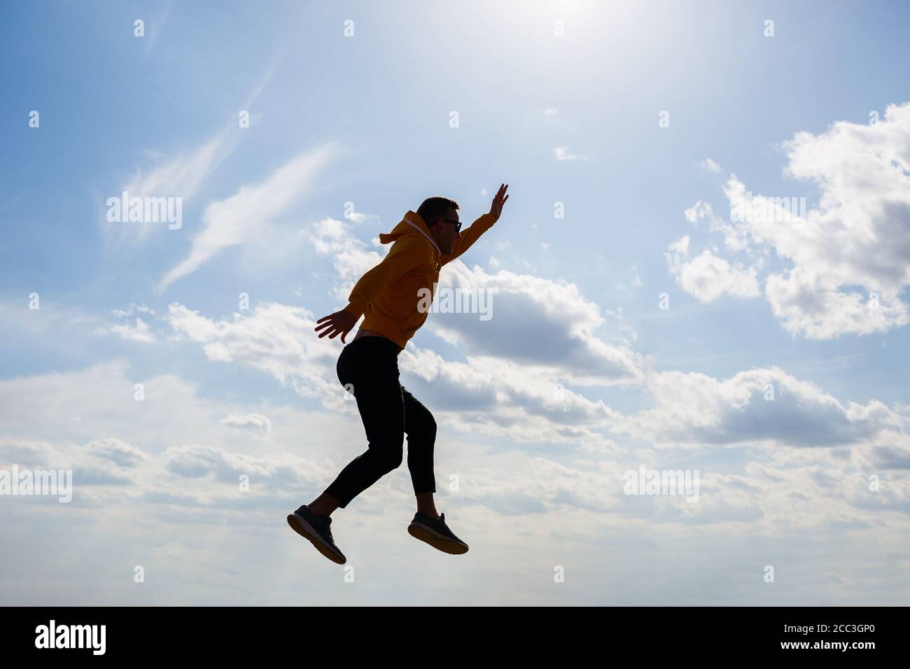 guy tourist freelancer on a background of blue sky with white clouds ...