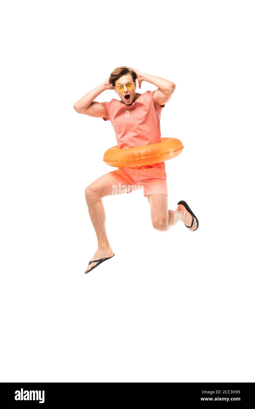 Shocked man in sunglasses and swim ring jumping isolated on white Stock ...