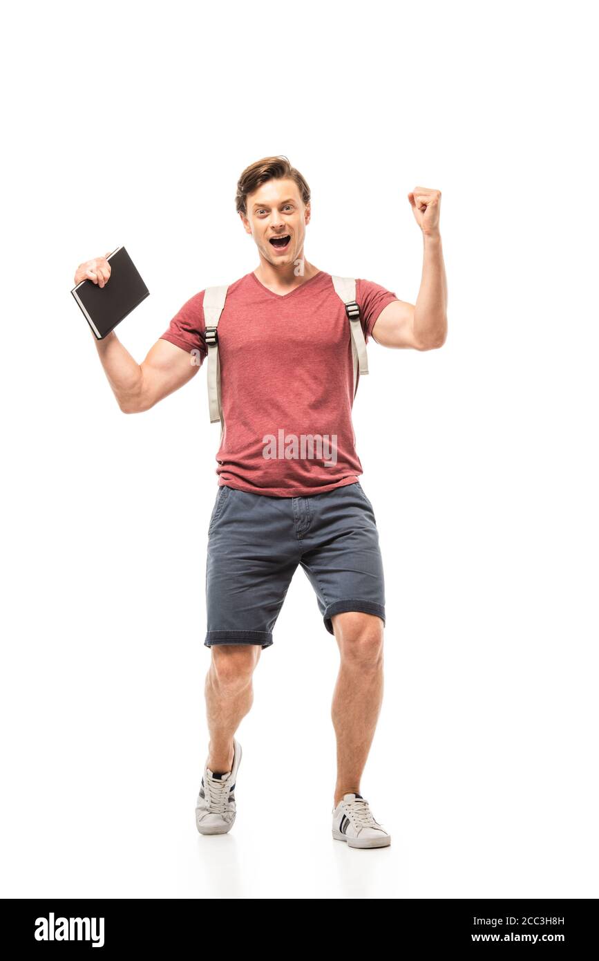 Student holding notebook and showing yeah gesture on white background ...
