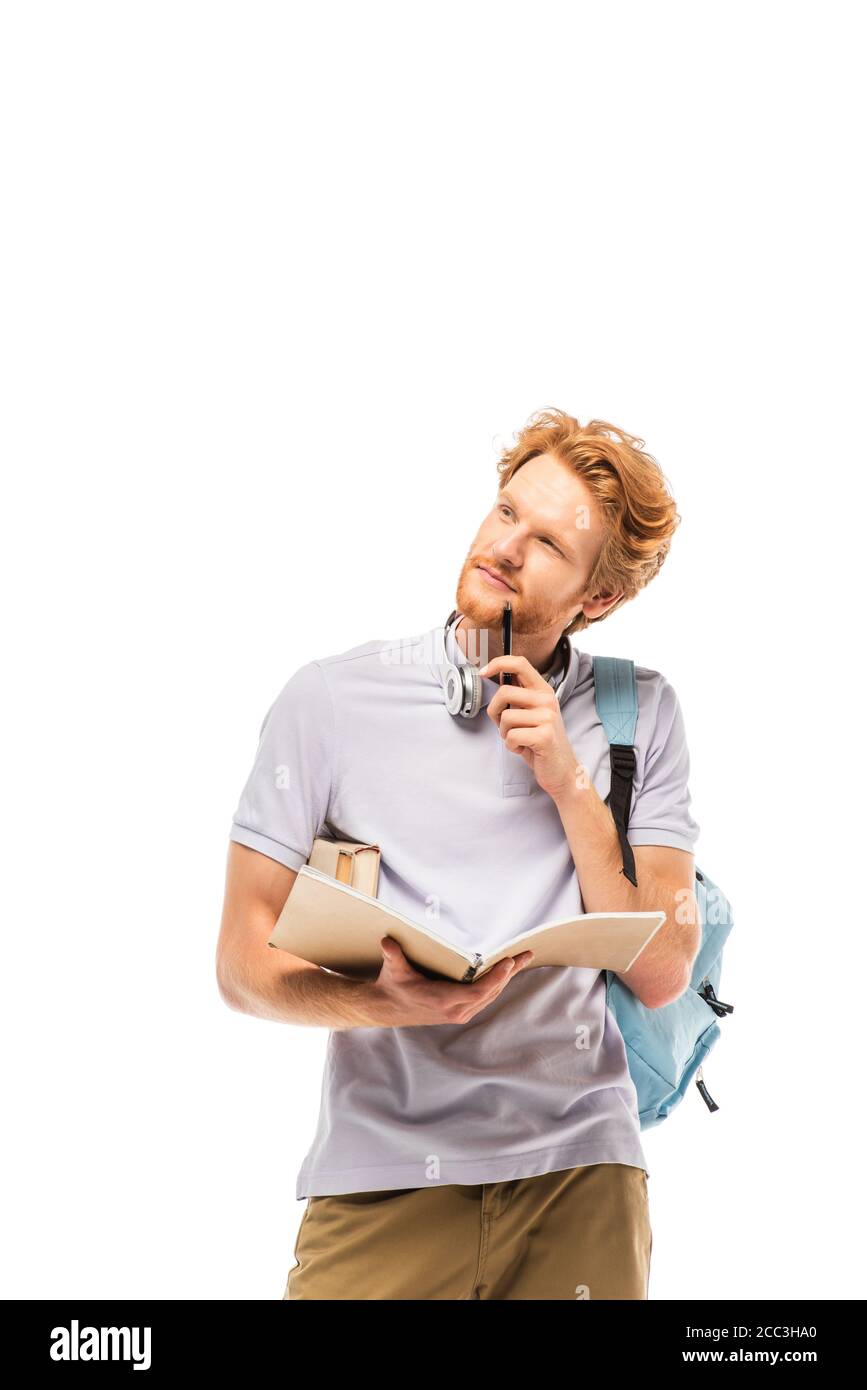 Thoughtful student holding pen and open notebook isolated on white ...
